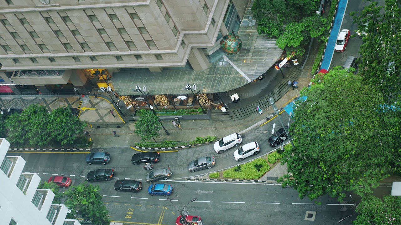Aerial top down view of traffic jam on the road and walking people ...