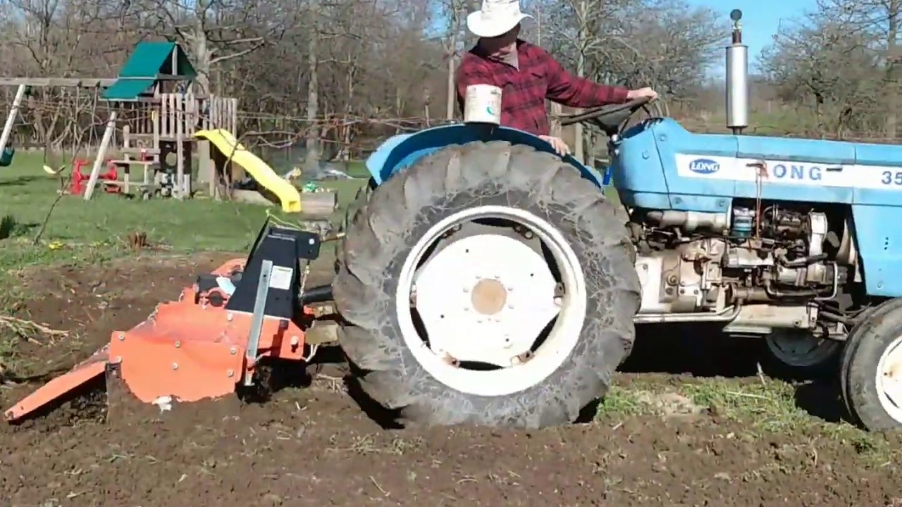 Rototilling Our Garden Soil For Planting - YouTube