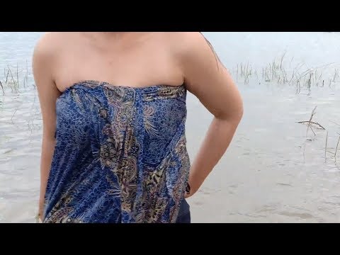 Cute girl use net fishing in the lake