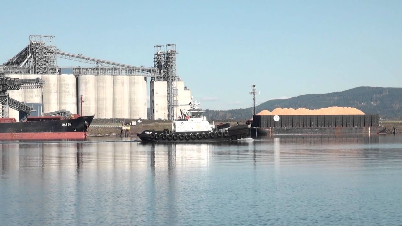 Foss Maritime Tugs Push Ship Into Dock - YouTube