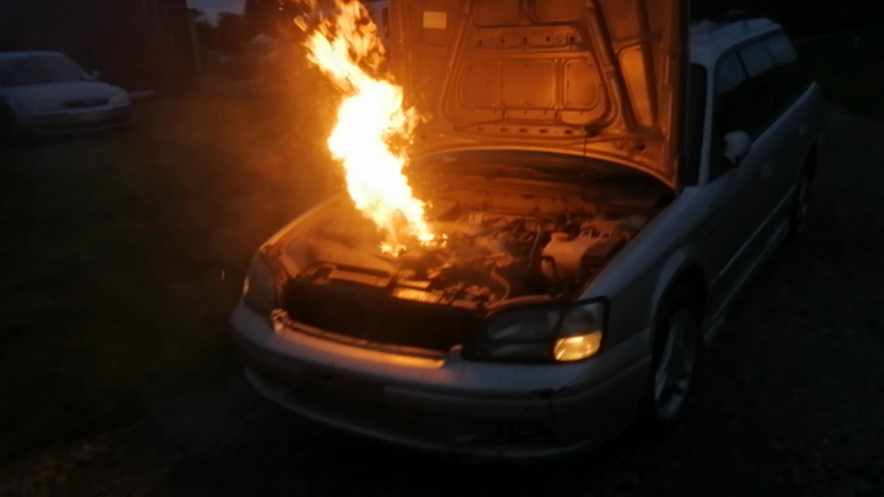 2.0L Subaru throws a rod + flames - YouTube