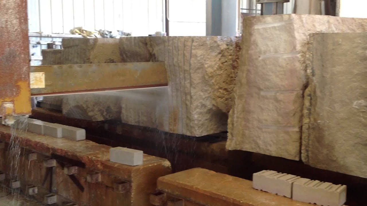 Mezger using belt saw to cut buff lueders limestone slabs - YouTube