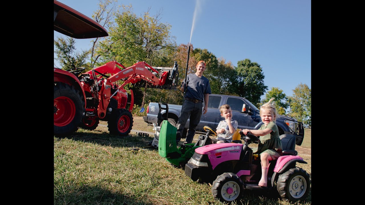 Washing kid tractors, big tractor, and truck with the pressure washer ...