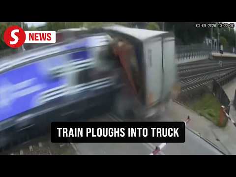 MOMENT: Train crashes through truck trailer in Poland