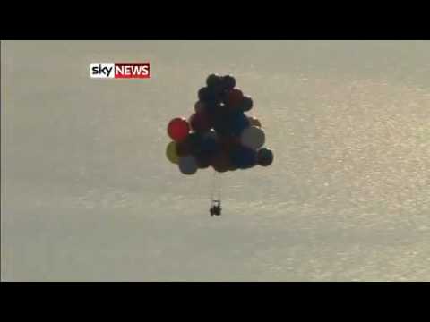 Jonathan Trappe's crosses the stretch with helium ballons - YouTube