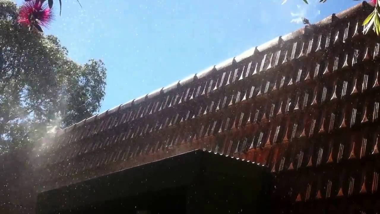 Sprinkler system on steep tile roof - YouTube