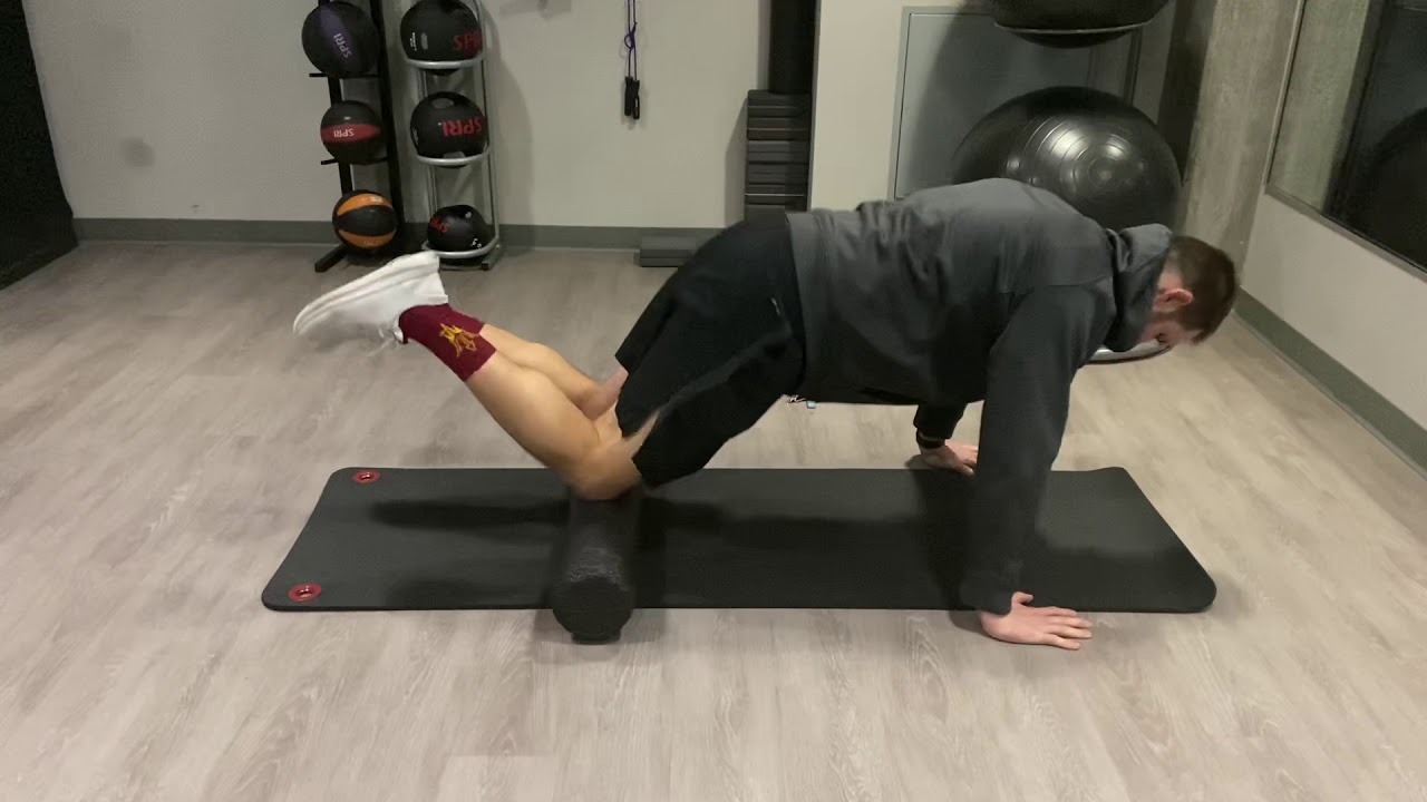 Prone pelvic tilting and lumbar ext from hands on foam roll - YouTube
