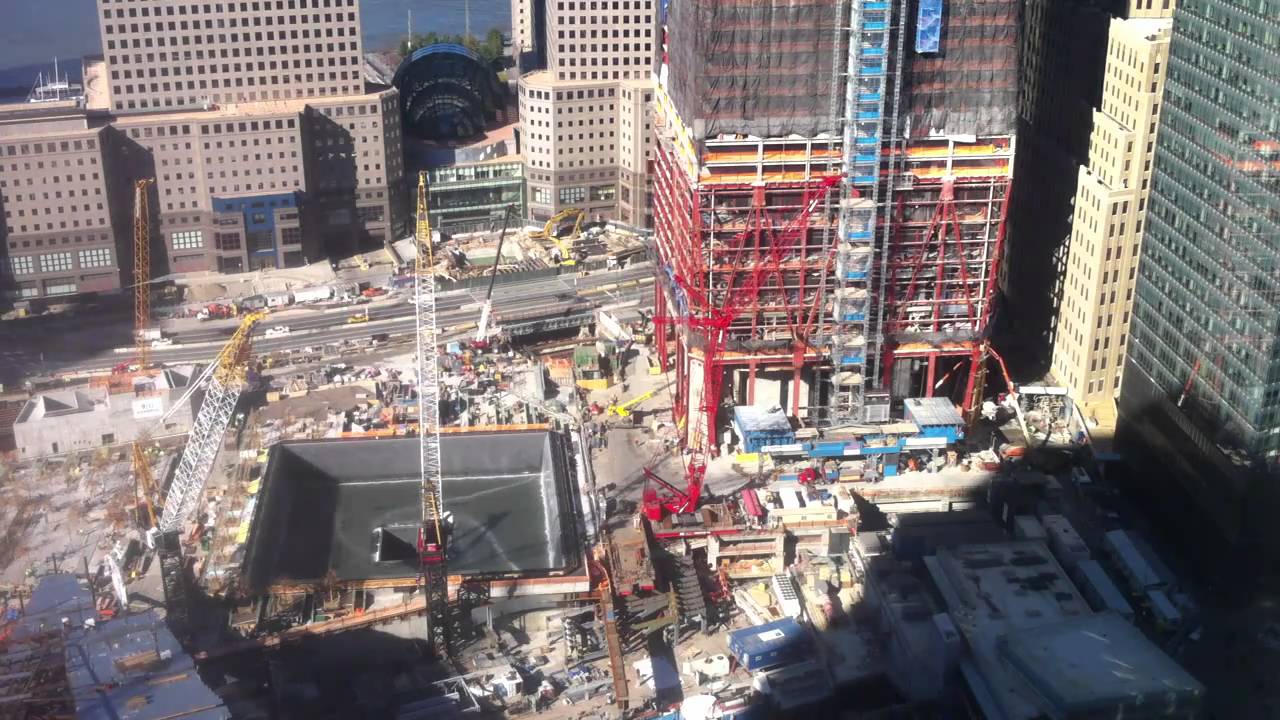 World Trade Center reflecting pool flowing and Freedom Tower ...
