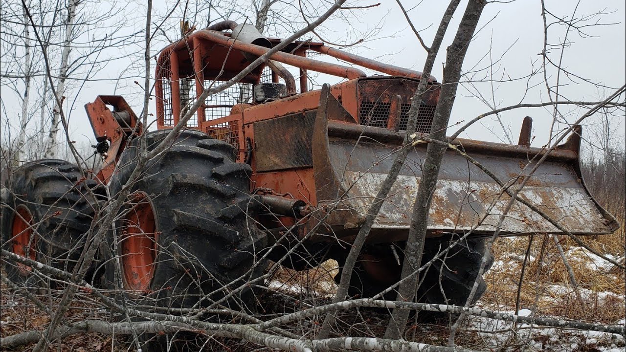 Logging with the Timberjack 230 Setting Chokers and Pulling Skids - YouTube