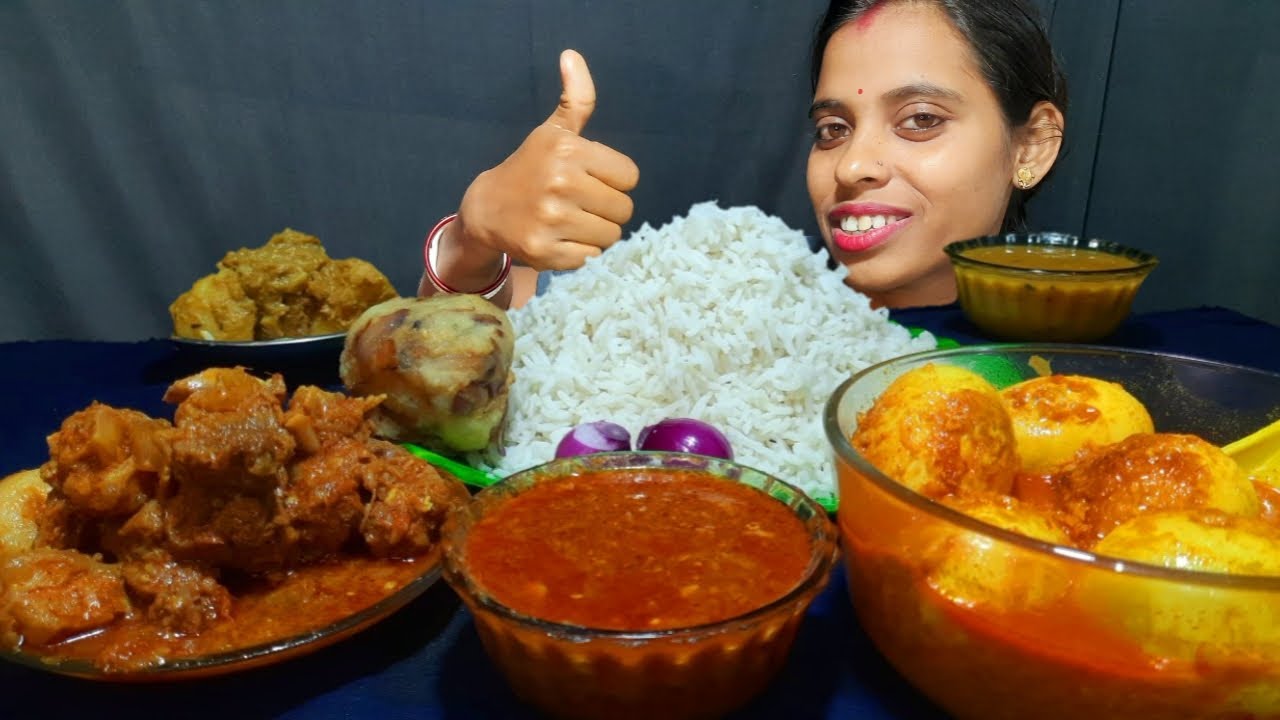 Eating Rice With Spicy Mutton Curry And Egg Curry, And Aloo Posto Aloo ...