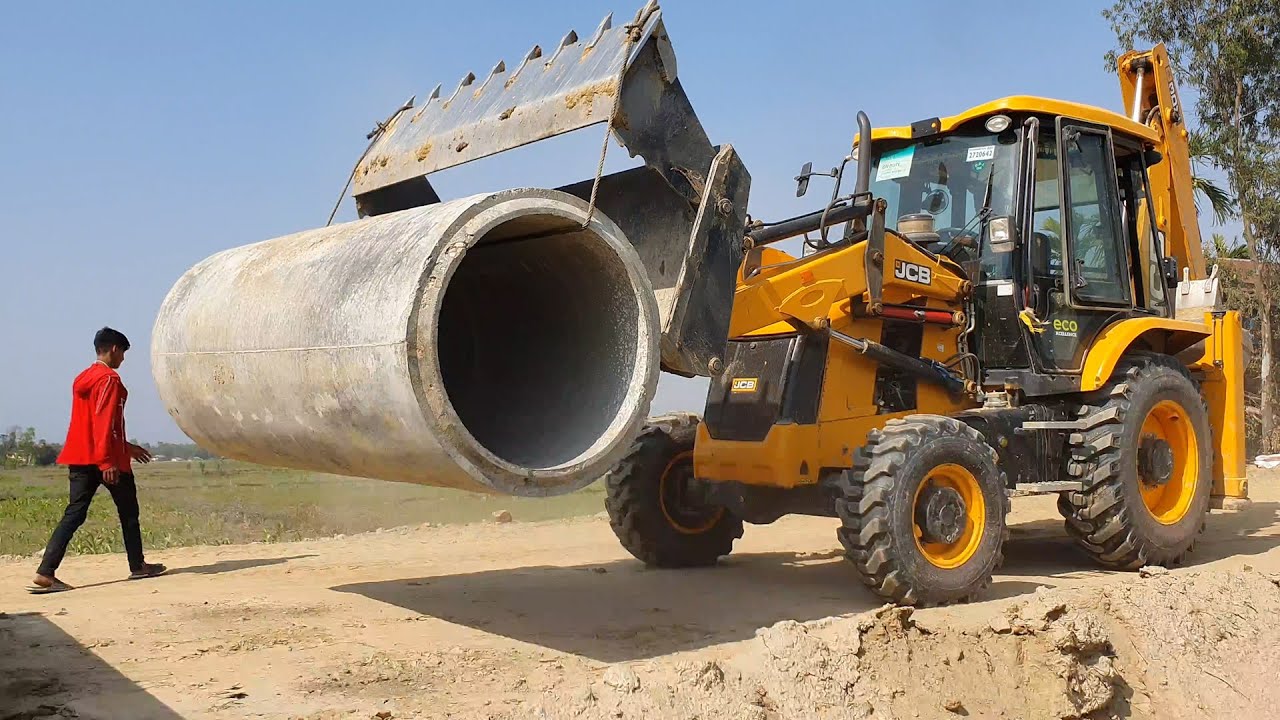 JCB Backhoe Lifting Heavy Culvert Pipe and Installing in Drain - JCB ...