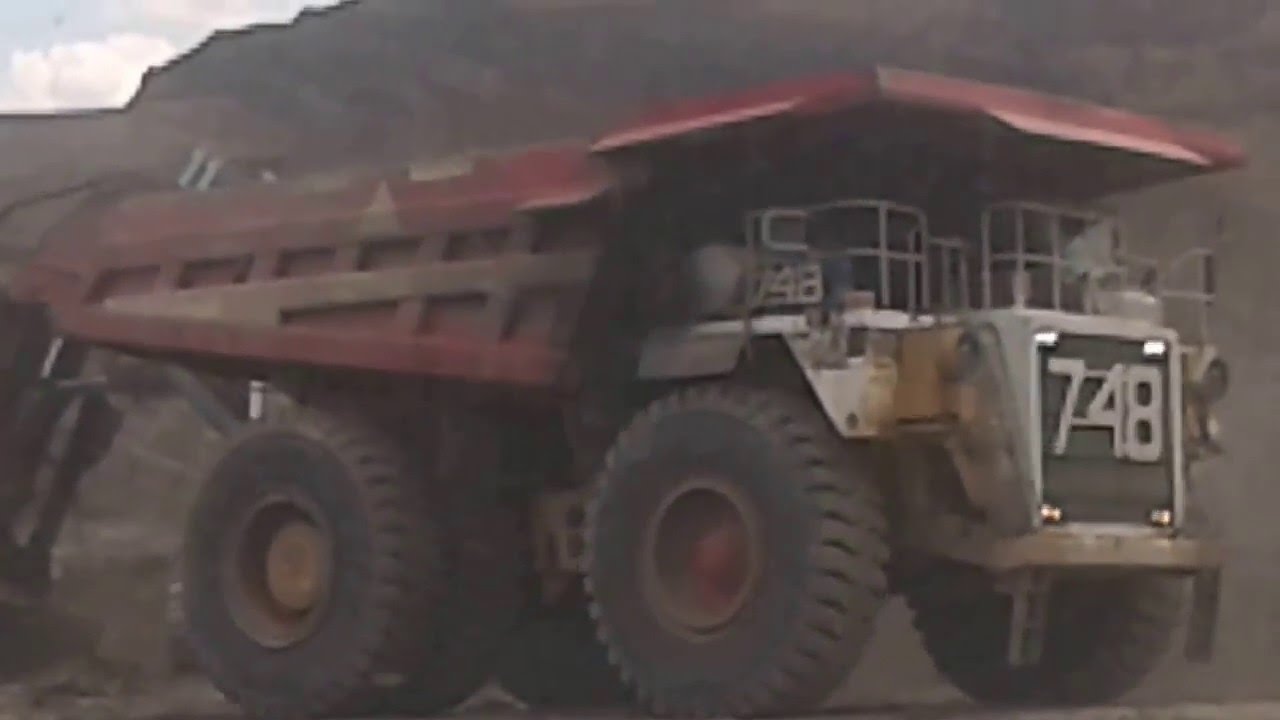 Liebherr Excavator with truck cat 789 in action at Coal mine - YouTube