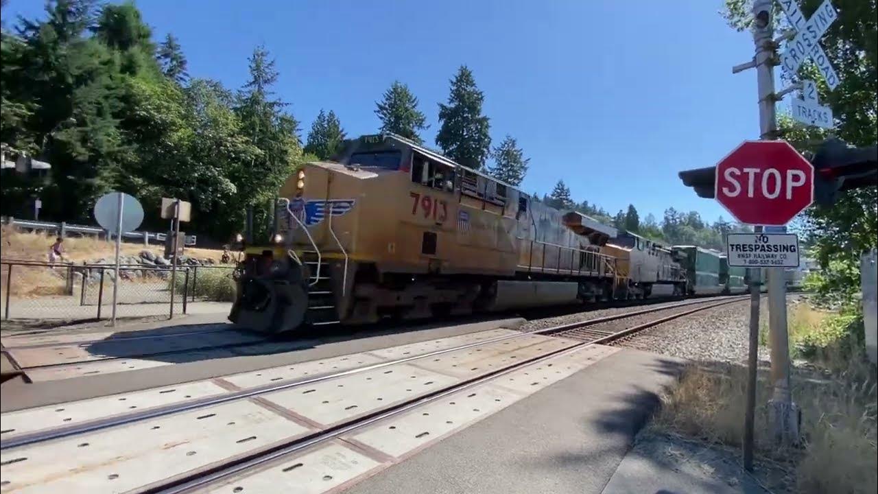 (Northbound) UP Garbage Train passes through the Sunnyside Beach Pedestrian Railroad Crossing ...