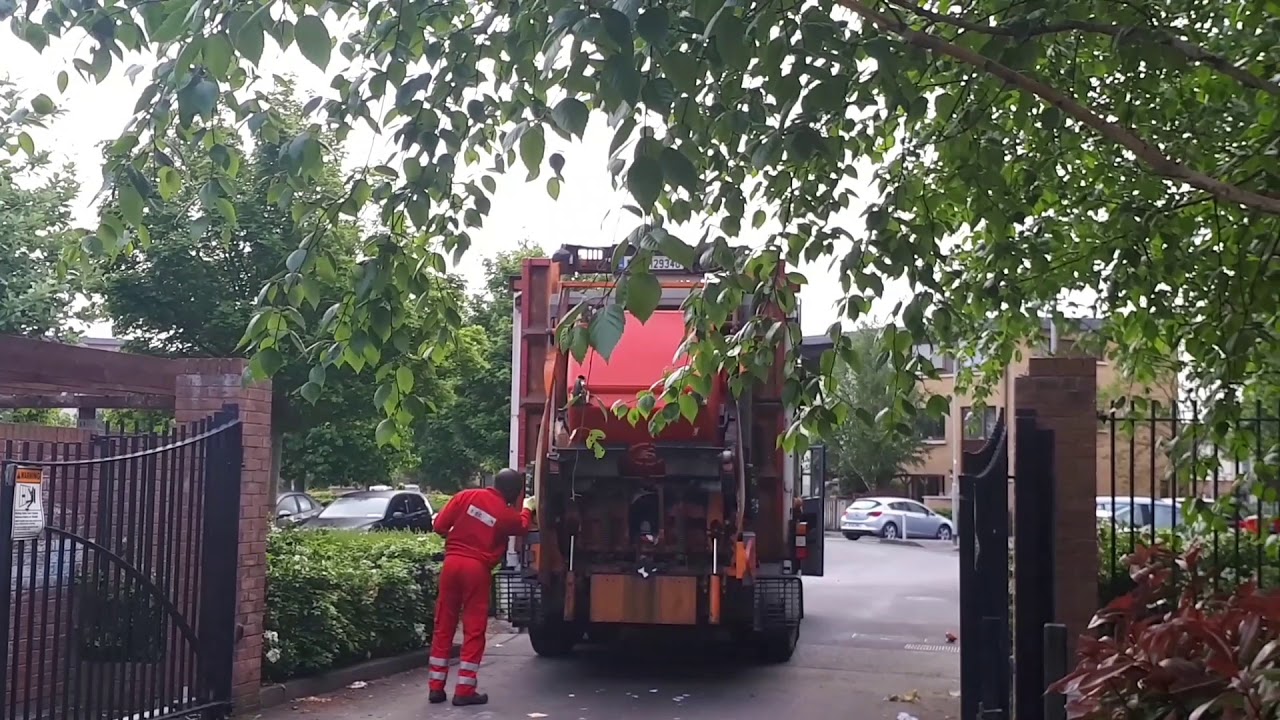 The city bin co bin truck collecting recycling bins - YouTube