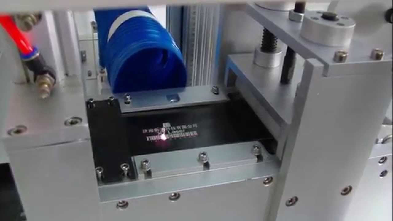 Fiber laser marking machine with special rotary table - YouTube