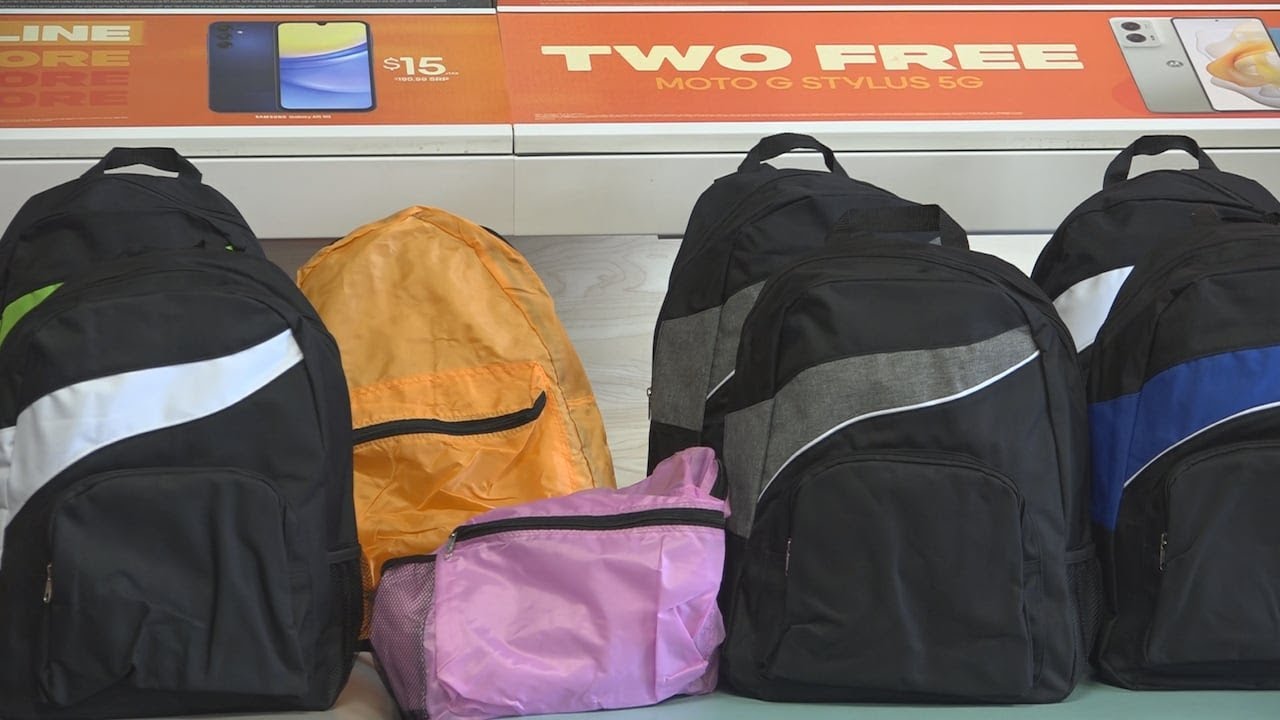 Boost Mobile in Alexandria holds backpack giveaway - YouTube