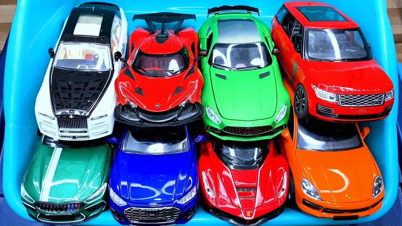 Box full of various miniature cars Peugeot, Jaguar, Pagani, Hyundai ...