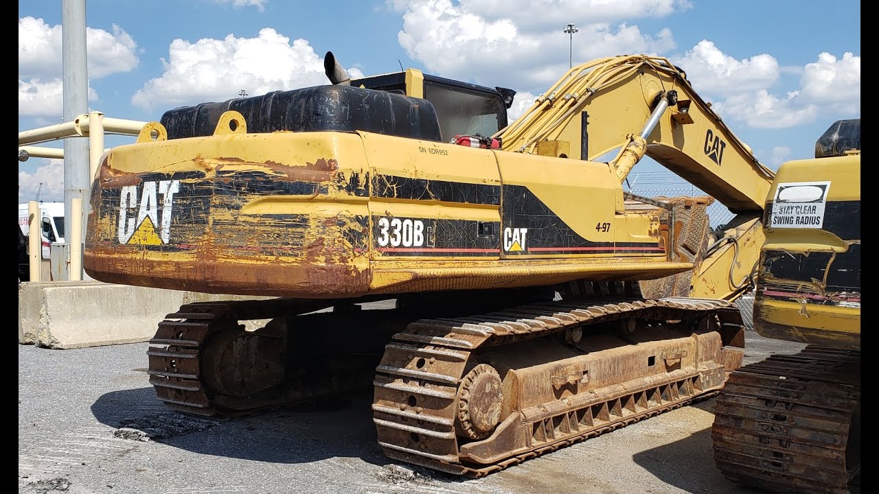 Unloading an ancient CATERPILLAR 330 excavator in Baltimore, MD - YouTube