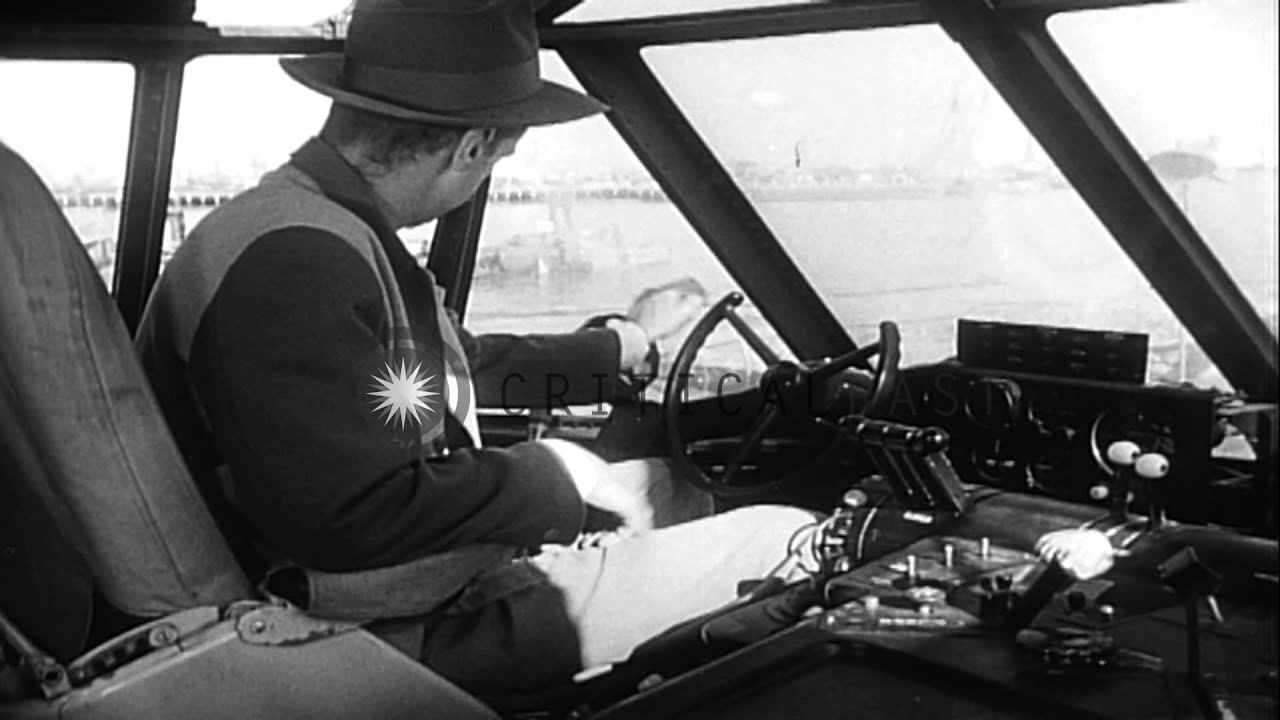 Aviator Howard Hughes flies his H-4 Hercules amphibious plane low above ...