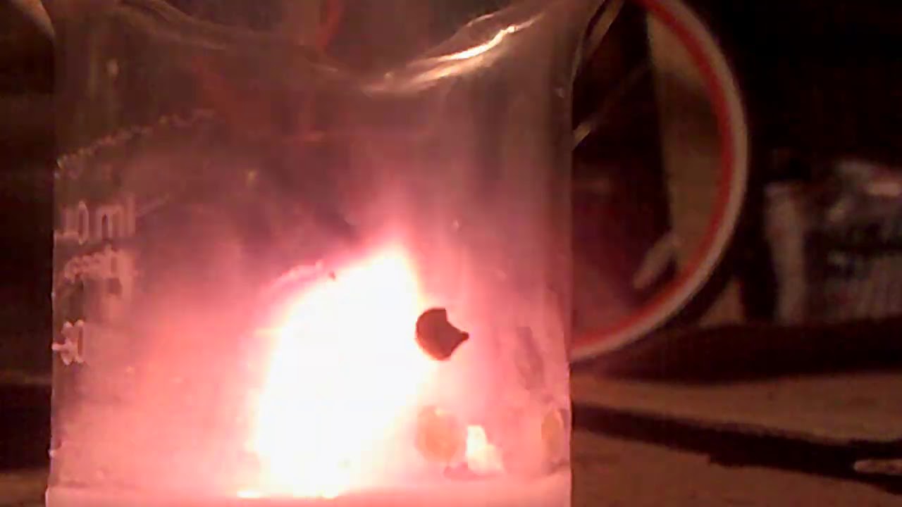 Potassium metal in 35% hydrogen peroxide - YouTube