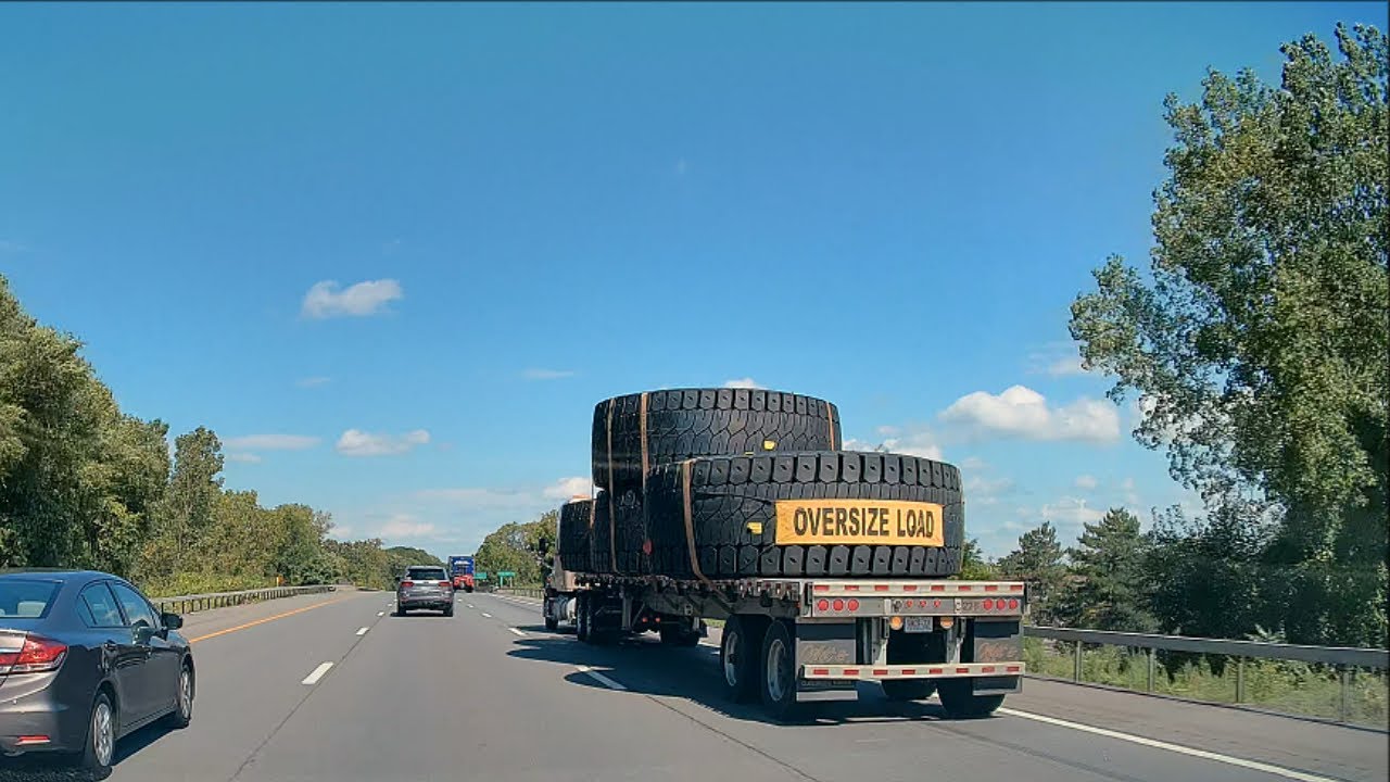 HUGE Oversized Tires On An Oversized Load Near The Interchange With I90 ...