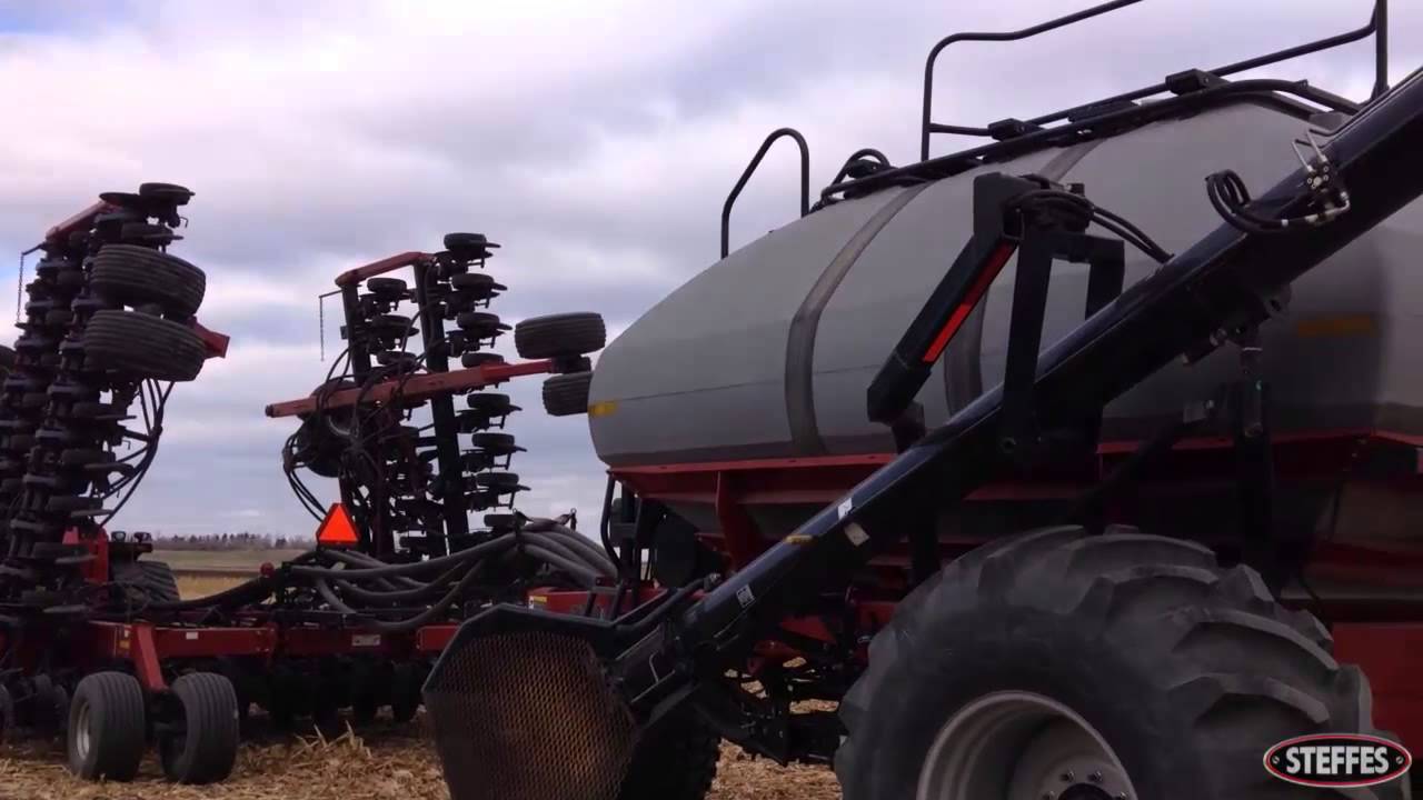 Case-IH SDX air seeder With Case-IH ADX3380 Commodity Cart - YouTube