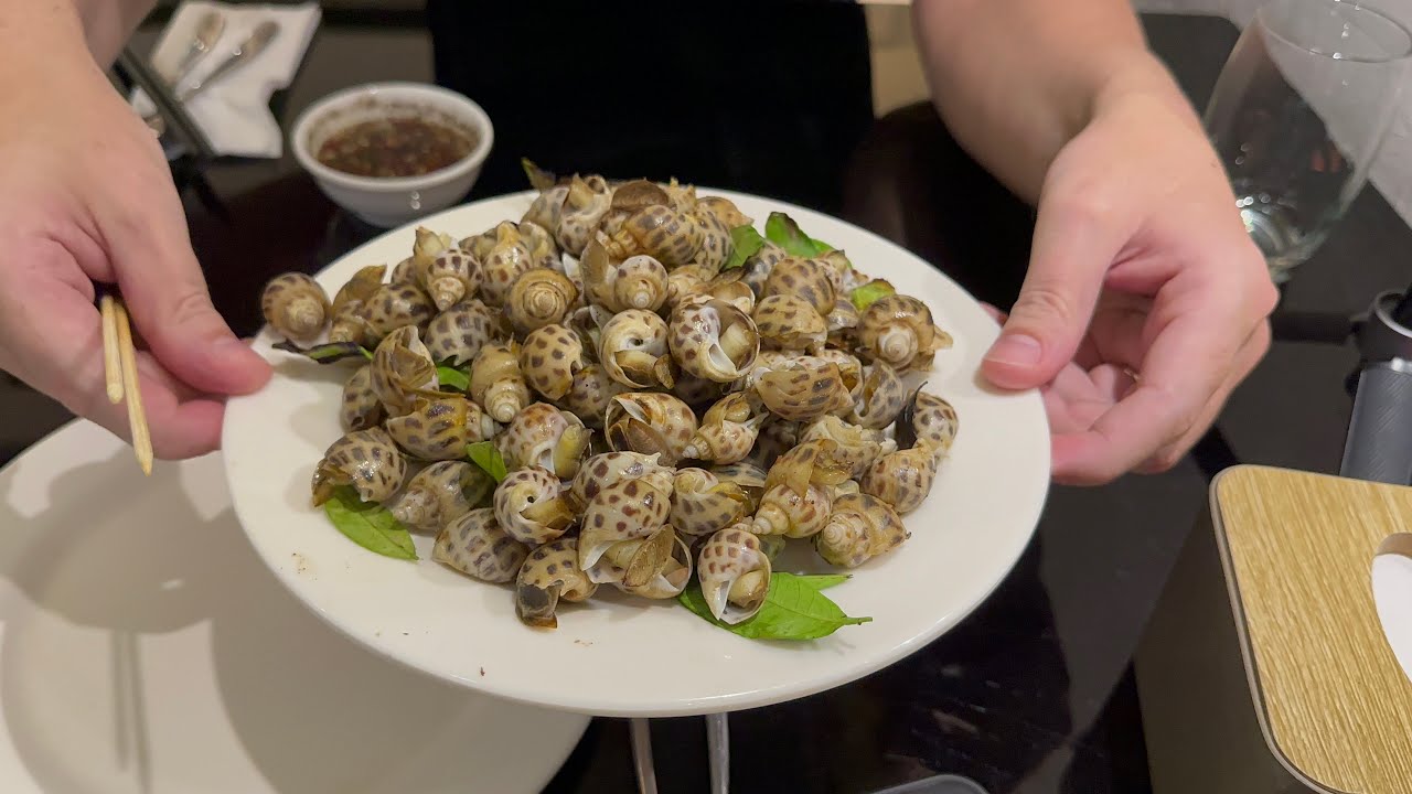 Enjoying my favourites... the grilled snails. - YouTube
