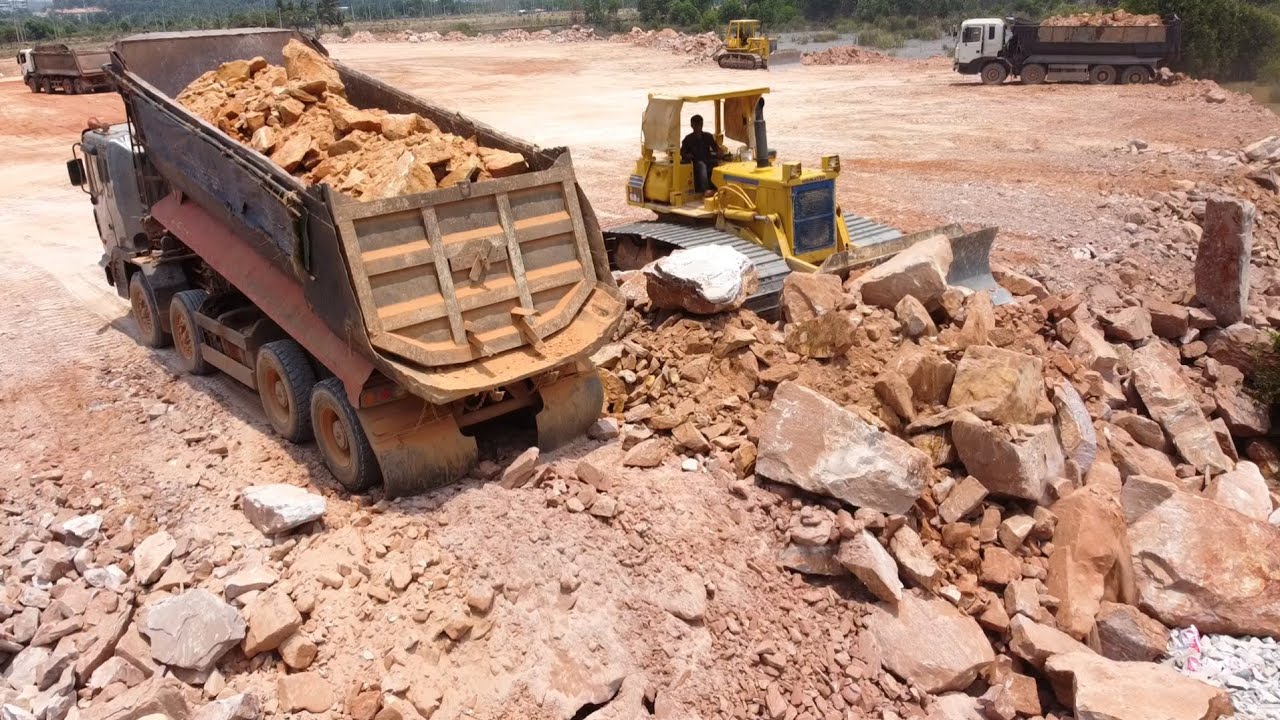 Start Continue projects mighty Power Bulldozer Pushing Stone/Dump truck ...
