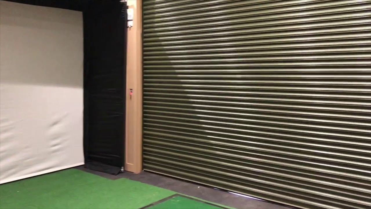 Golf Simulator Enclosure in a roller shutter Driving Range Bay. - YouTube
