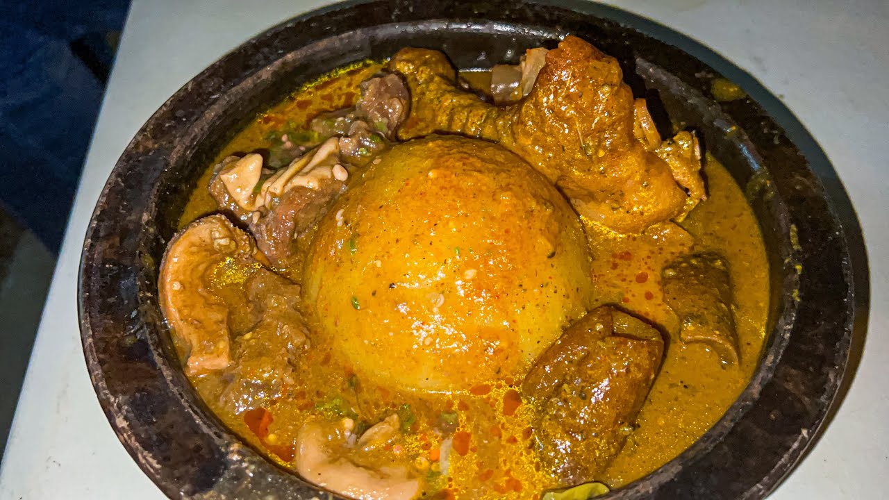 Placali with seed sauce and lots of meats - Côte d’Ivoire streetfood ...