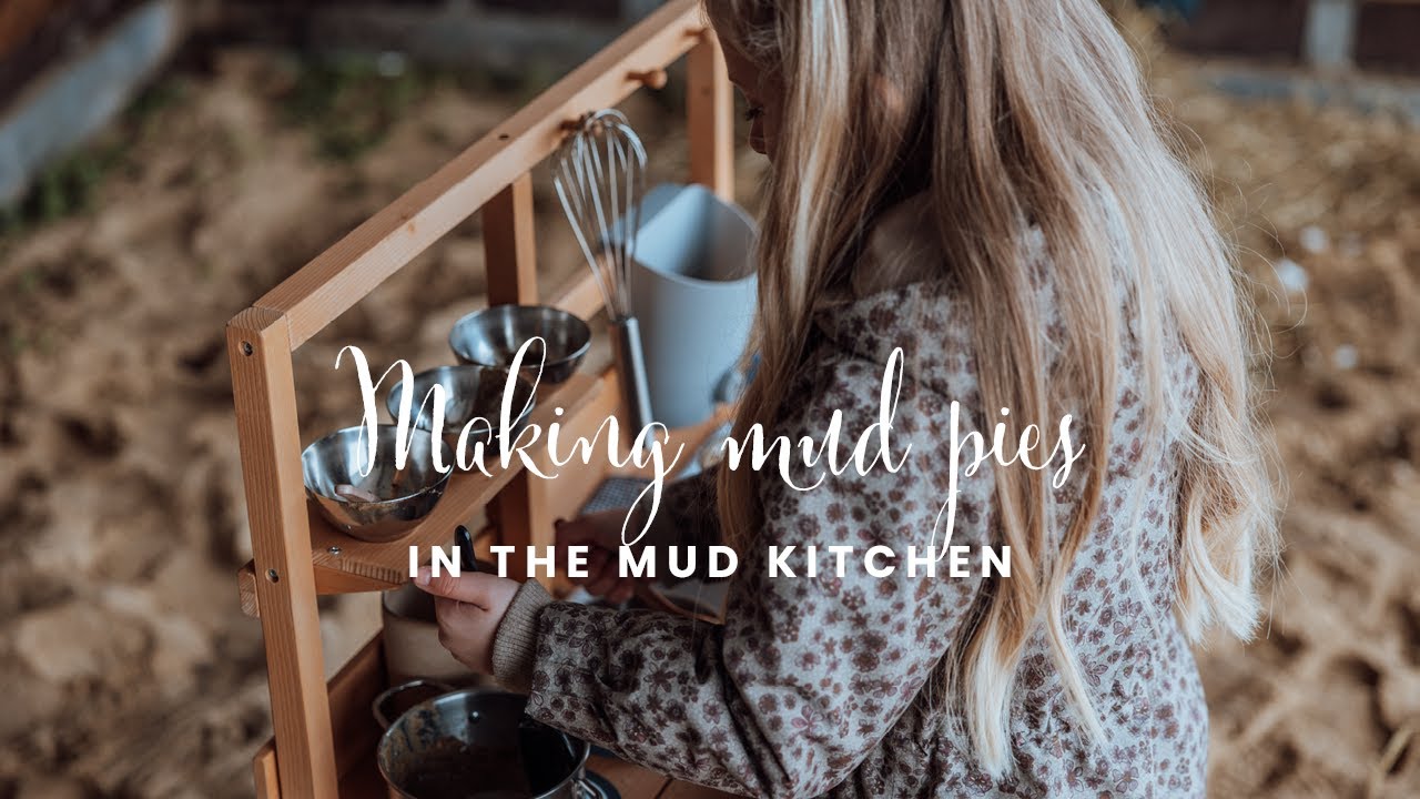 Little girl is making mud pies in her outdoor play kitchen - YouTube