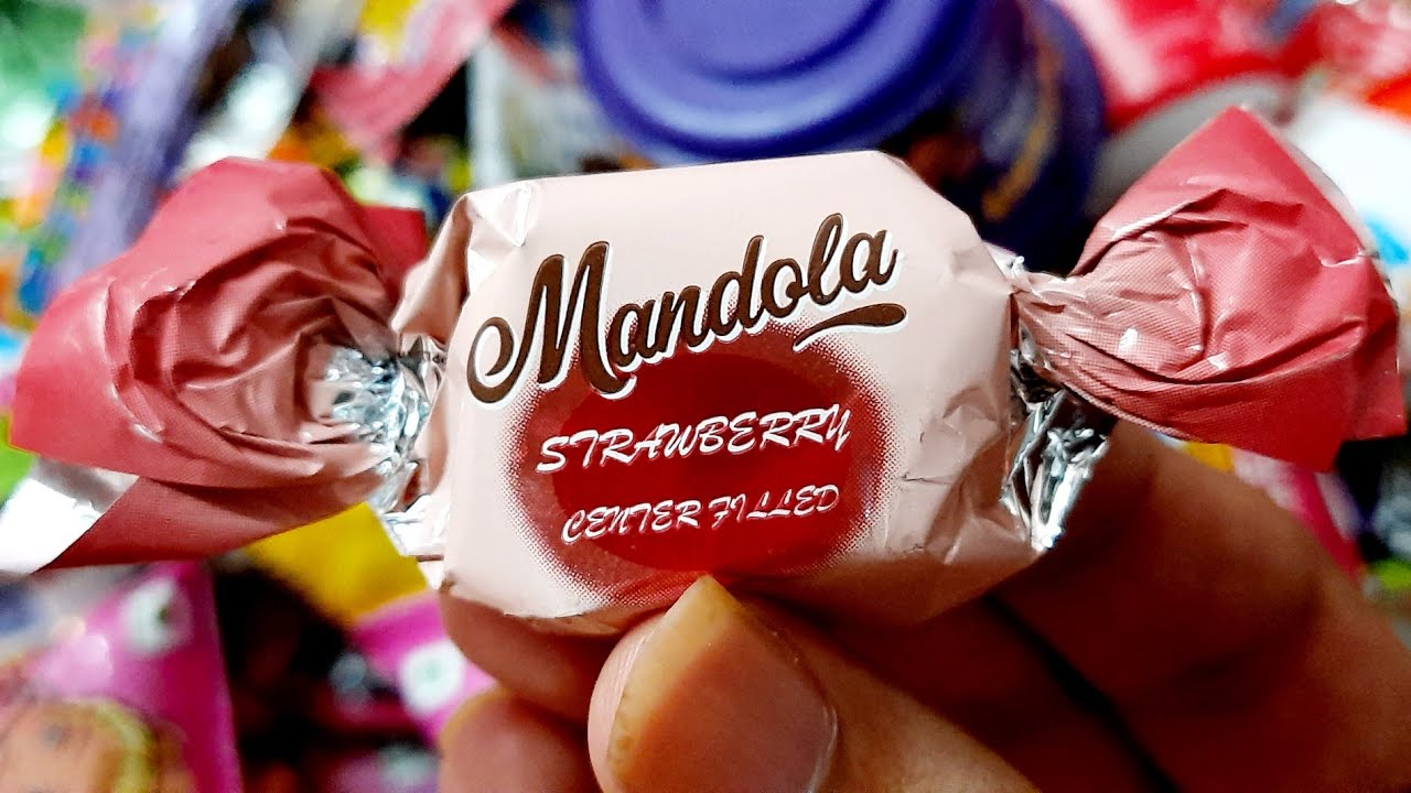 some lots of candies and chocolates with mandola strawberry chocolate 🍫 ...