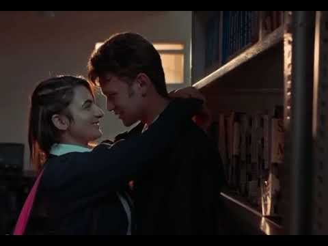 School student kissing in library 