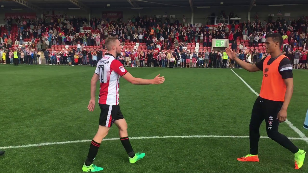 Players and staff celebrate the win over Crawley with the fans - YouTube