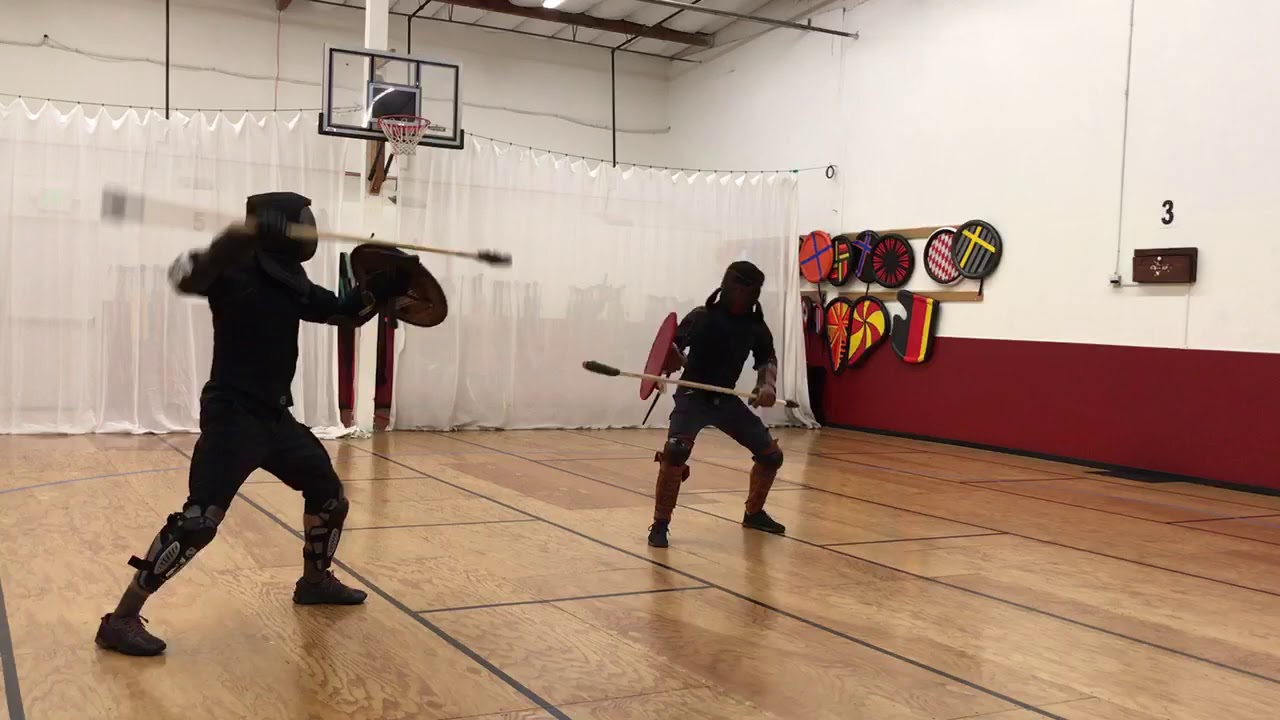 Spear and shield fighting - YouTube