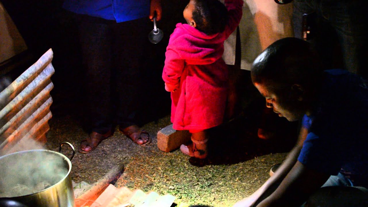 Cutting and eating freshly cooked goat entrails, Tugela Ferry, KZN ...