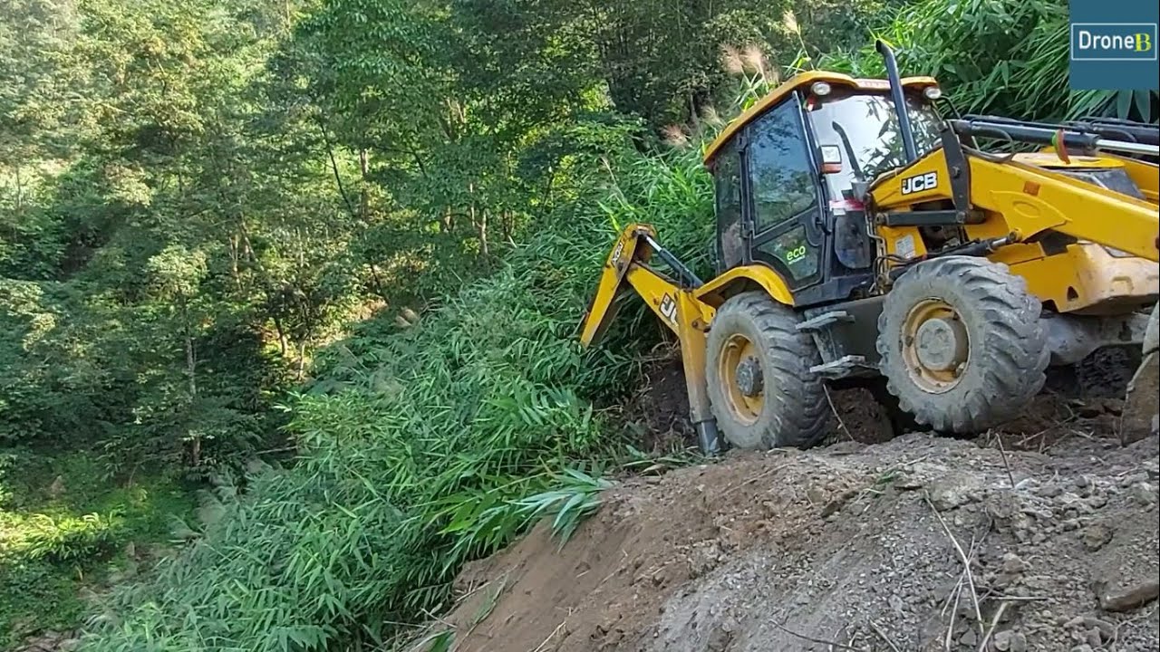 GRASS BROOM PLANTATION-Backhoe Loader-Cutting Rocky Hill for Hilly Road ...