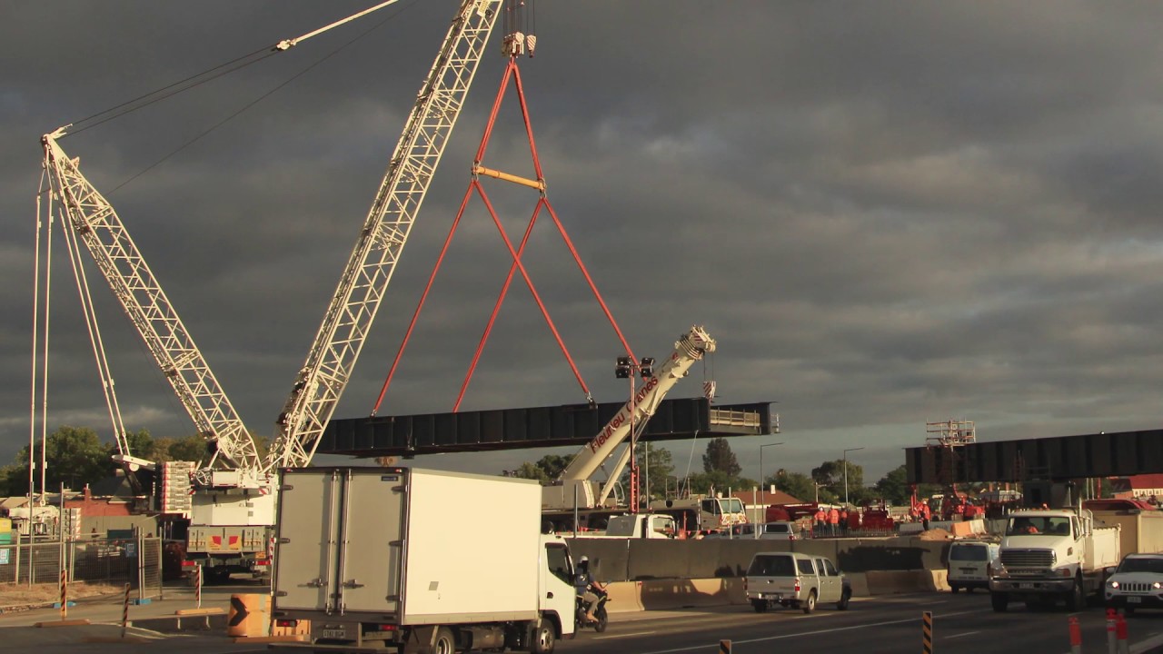 Construction of the Outer Harbor rail overpass - YouTube