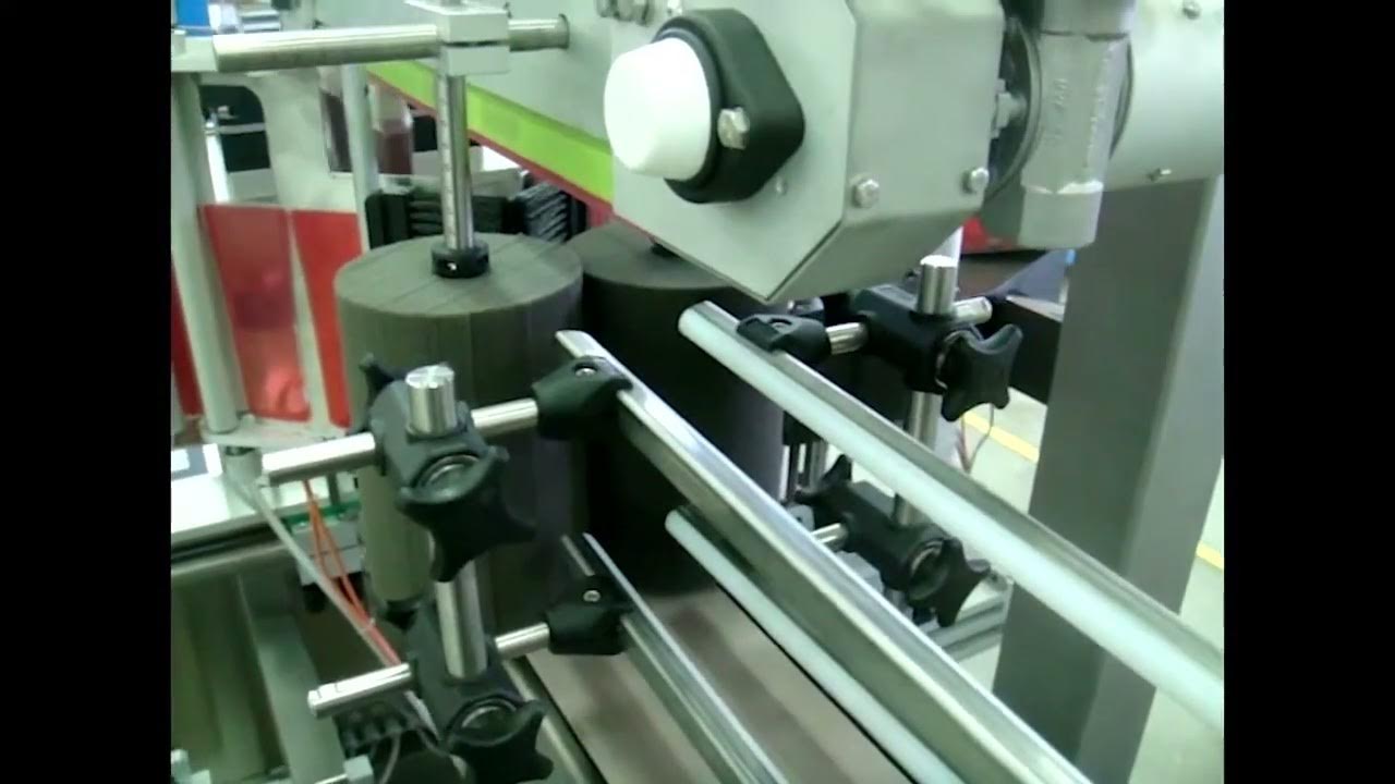 Emrich Packaging Machinery - Arca Double Sided Labelling Machine - Toiletries - Henkel - YouTube
