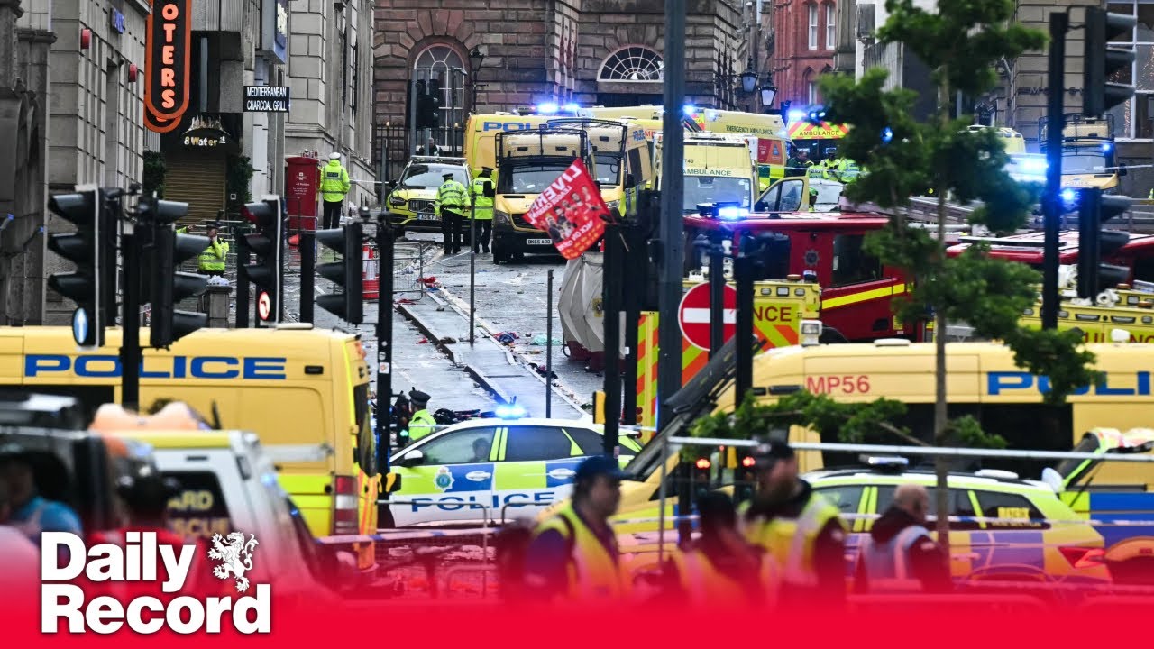 Liverpool bus parade horror sees man detained after car collides with ...