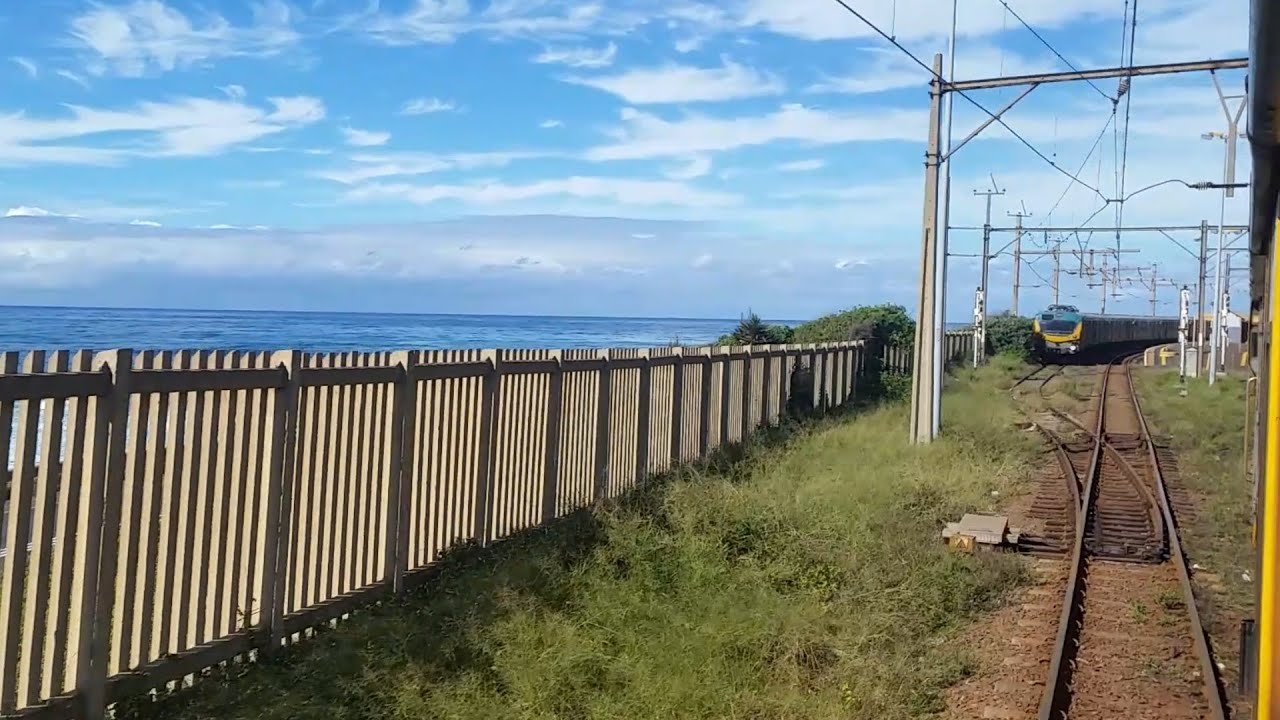 Train ride on a Metro 10m5 local passenger train heading to Umkomaas ...