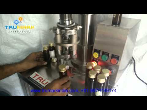 FILLING CAPPING LABELING MACHINES: Semi Automatic Capping machine- cam ...