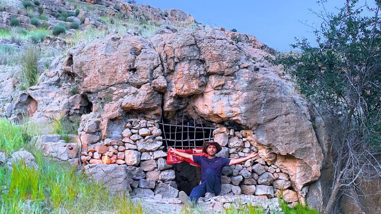 I Built a Primitive Bushcraft Shelter in a Mountain Cave with Fireplace ...