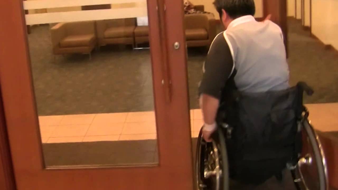 Paraplegic opens double doors and masters very steep ramp - YouTube