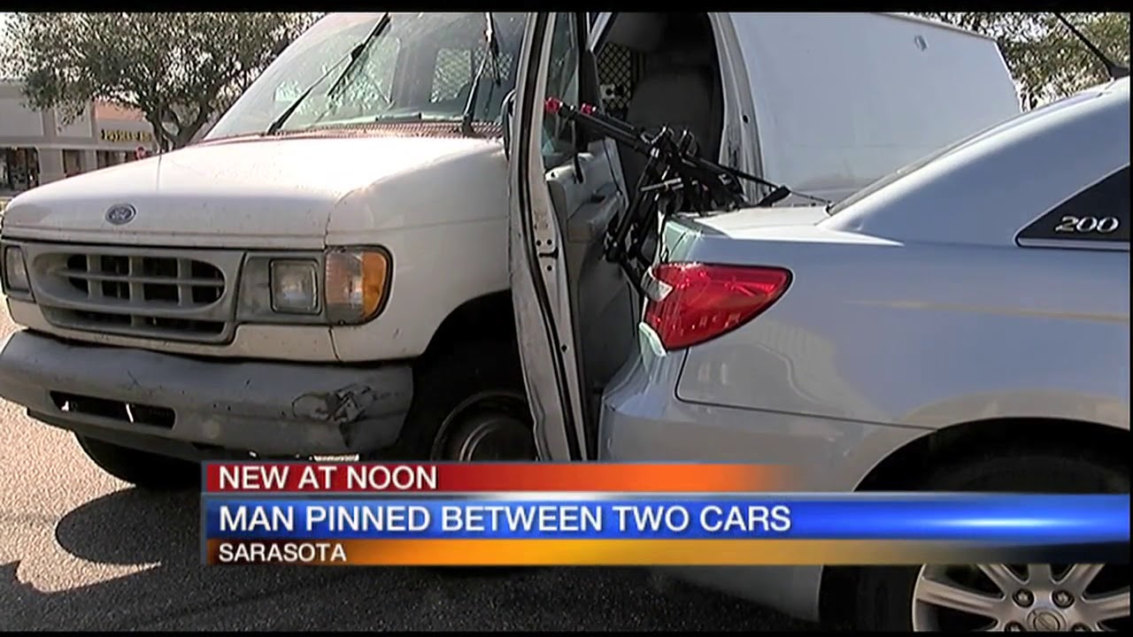 Man Pinned Between Two Vehicles - YouTube