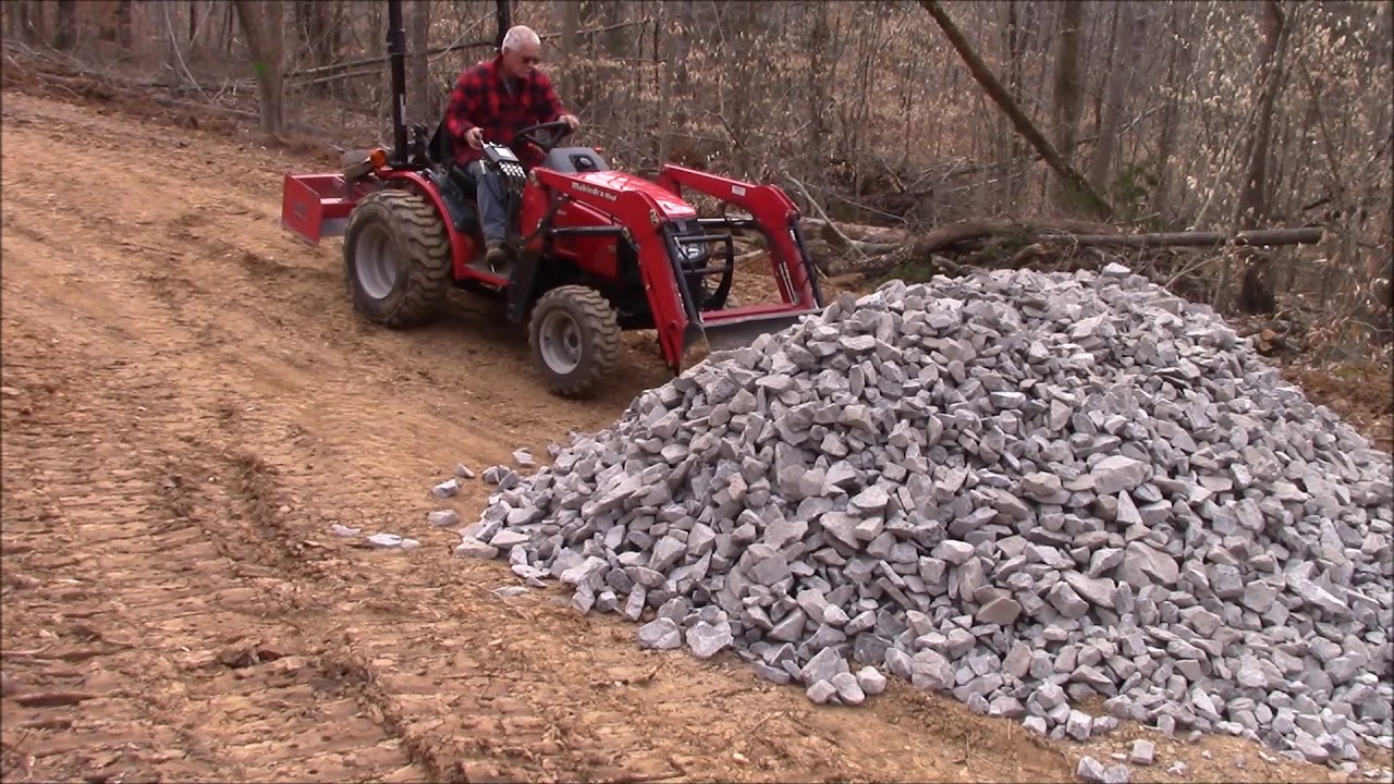 Spreading surge rock, culvert work - YouTube