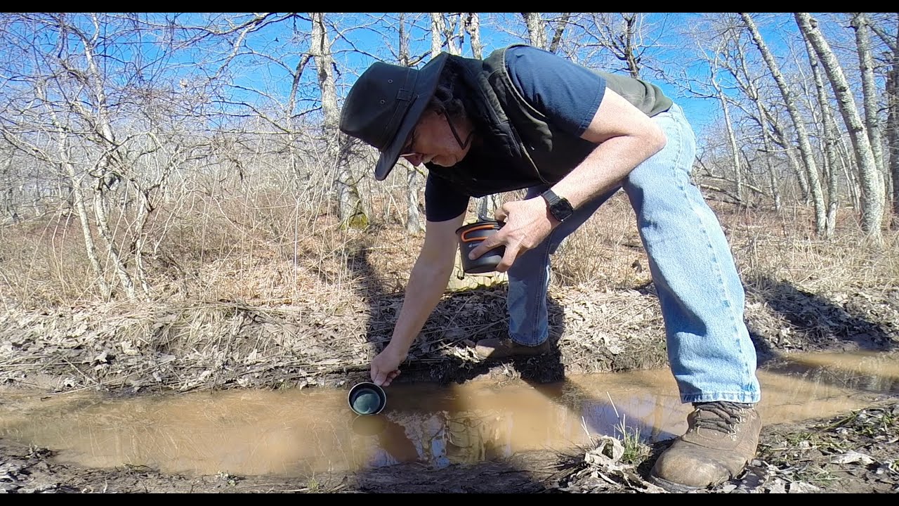 FILTERING WATER FROM A MUD HOLE TO DRINK - YouTube