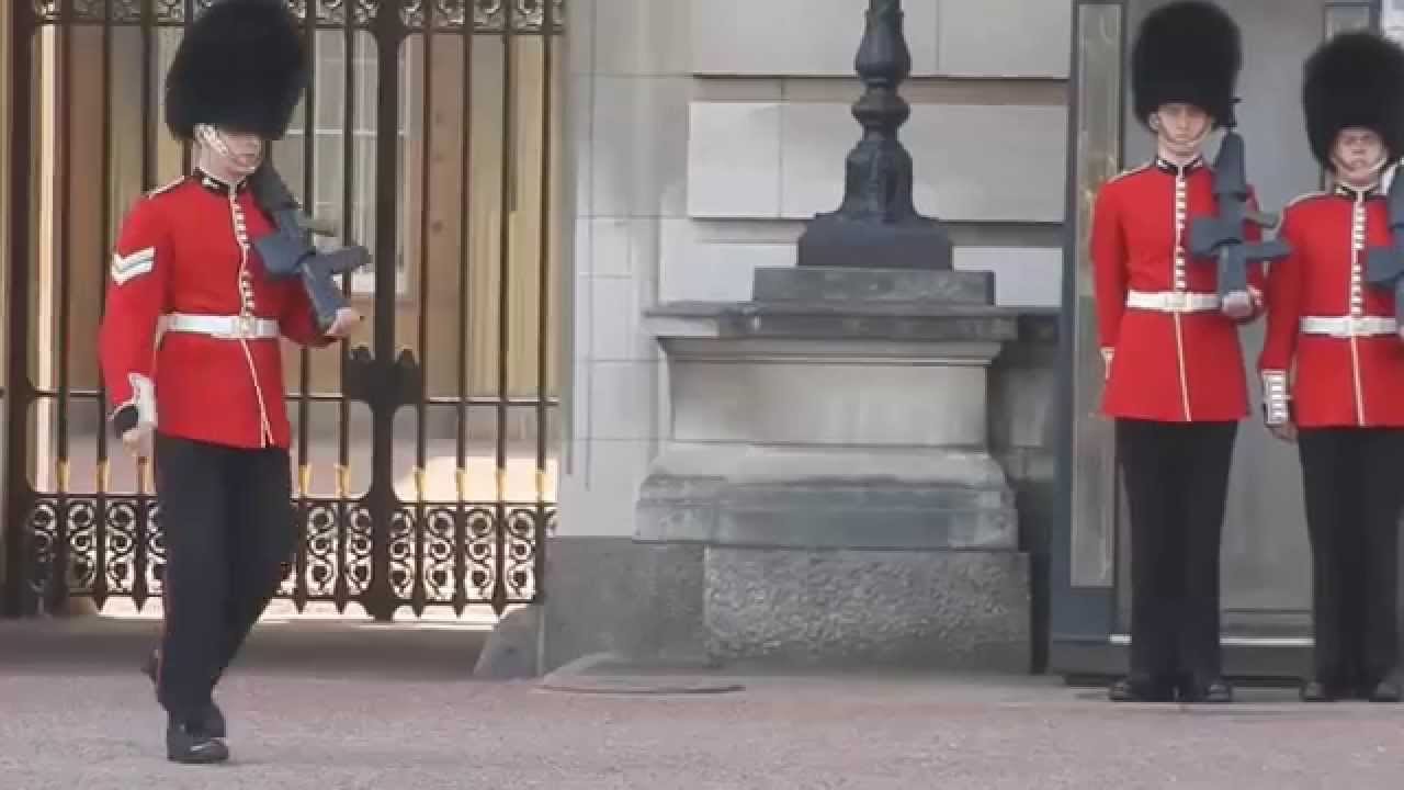 Buckingham Palace guard slips and falls in front of tourists - YouTube