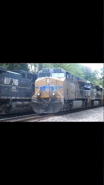 UP 5275 with NS power pass by parked NS train. - YouTube