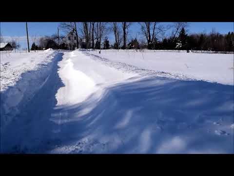 big snowdrift blocks long driveway - YouTube